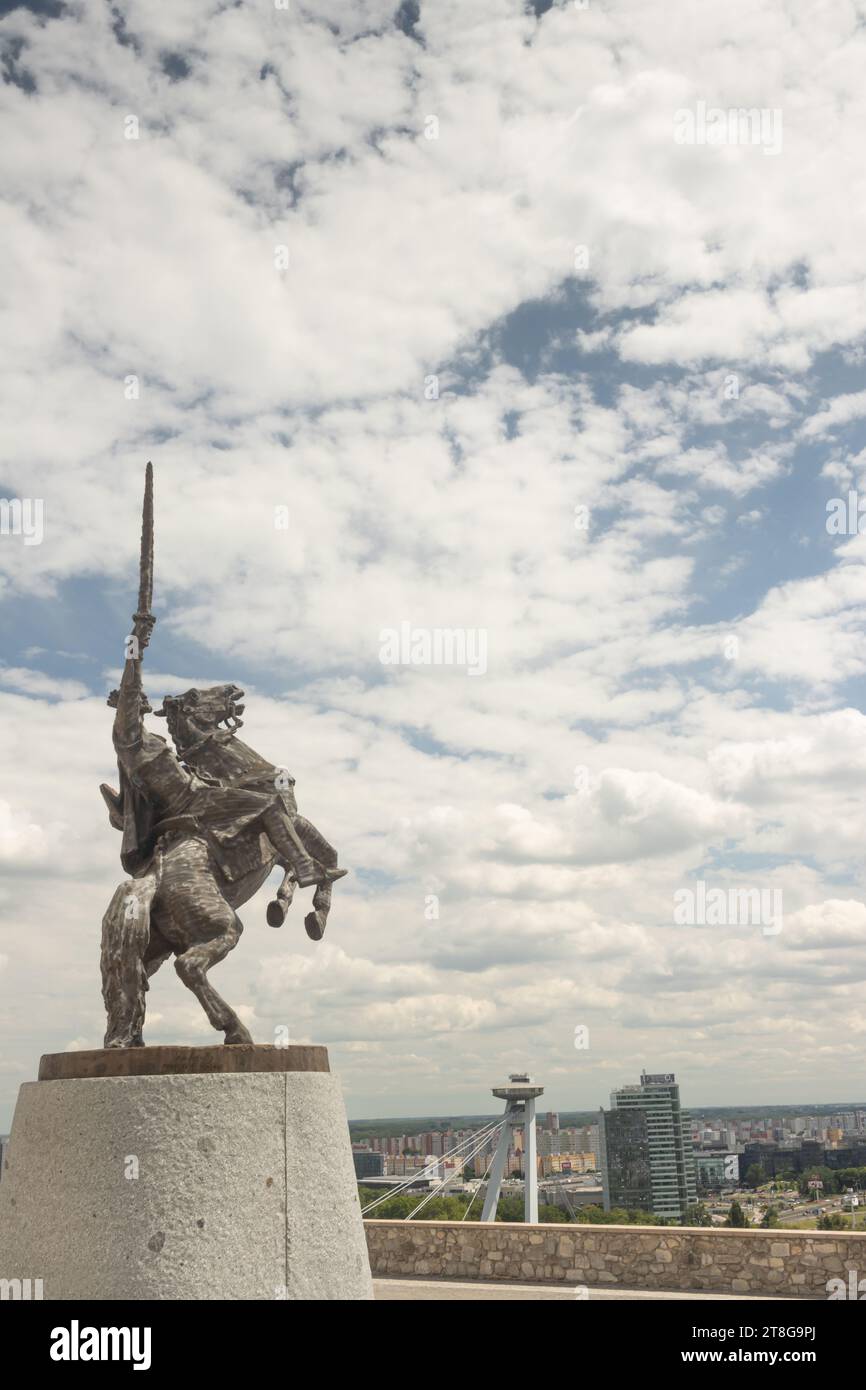 Statue of King Svatopluk and the castle on a hill above the old town ...
