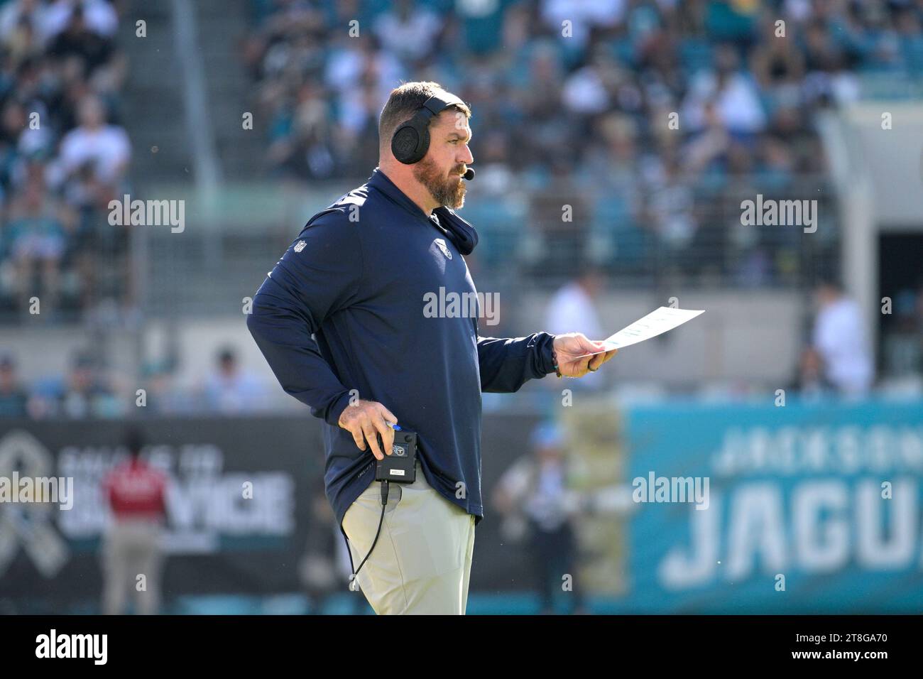 Tennessee Titans offensive coordinator Tim Kelly works from the ...