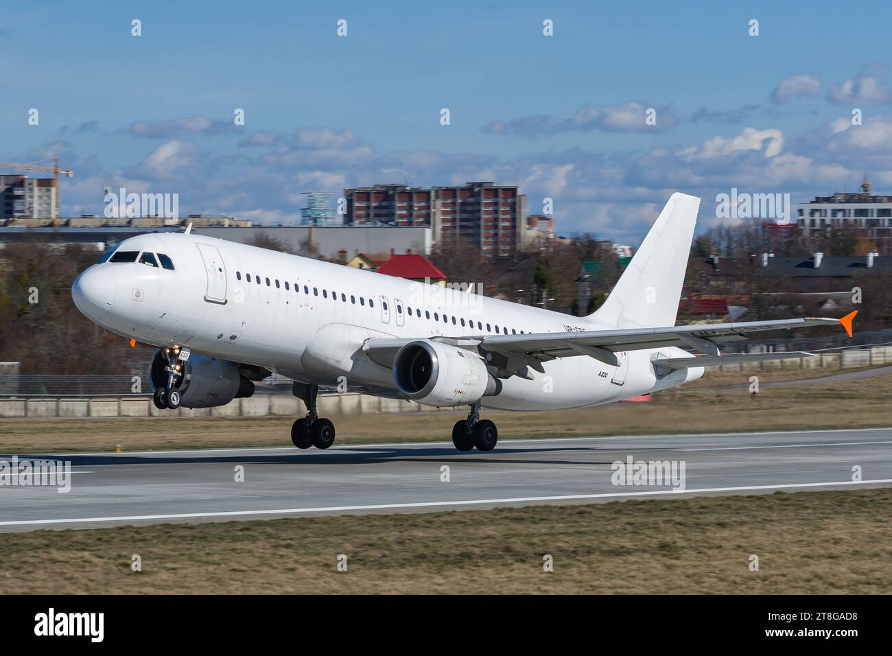 White aircraft taking off runway hi-res stock photography and images ...