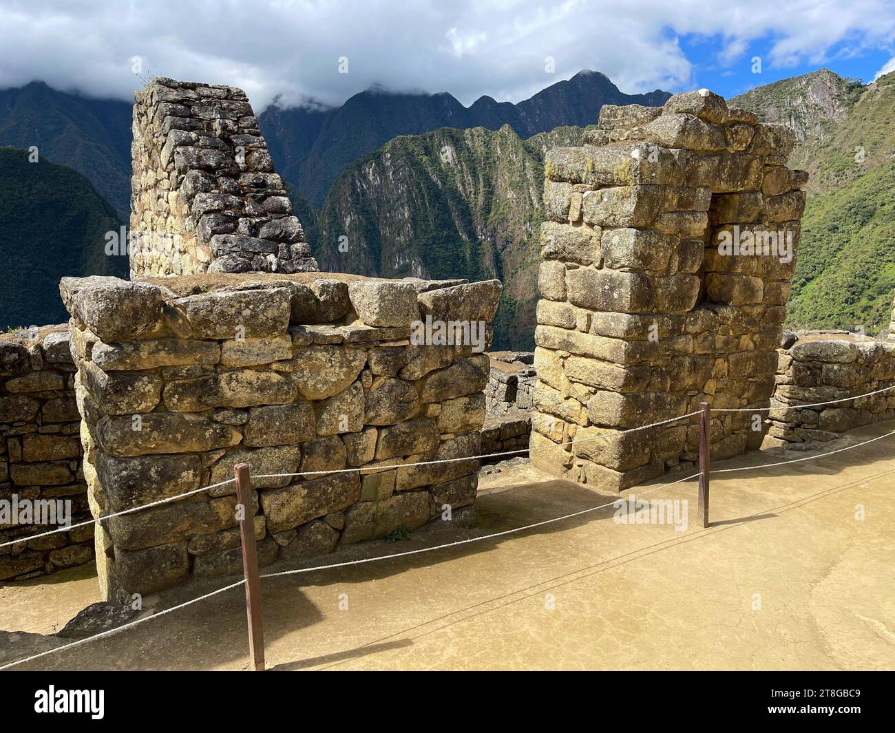 A rugged mountain landscape featuring historic ruins of Machu Picchu ...