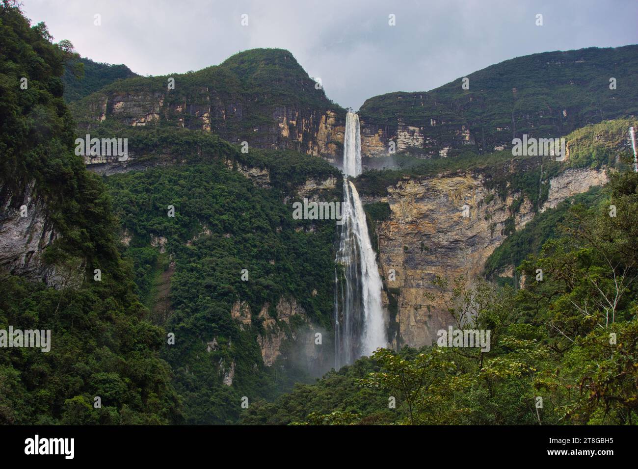 This is a scenic image of majestic Gocta Falls cascading down from a ...