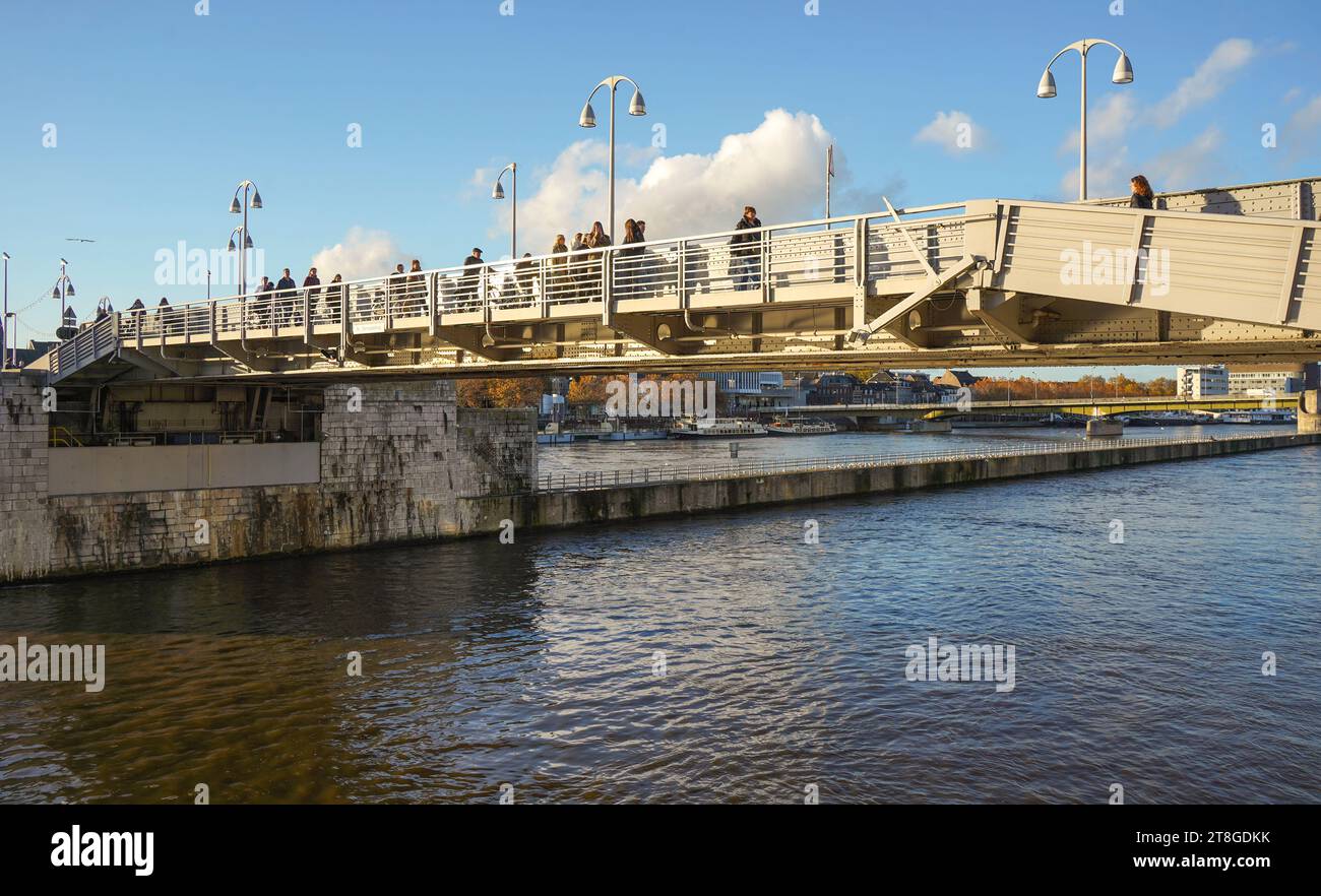 Pedestrians crossing the vertical lift bridge Sint Servaasbrug, St ...