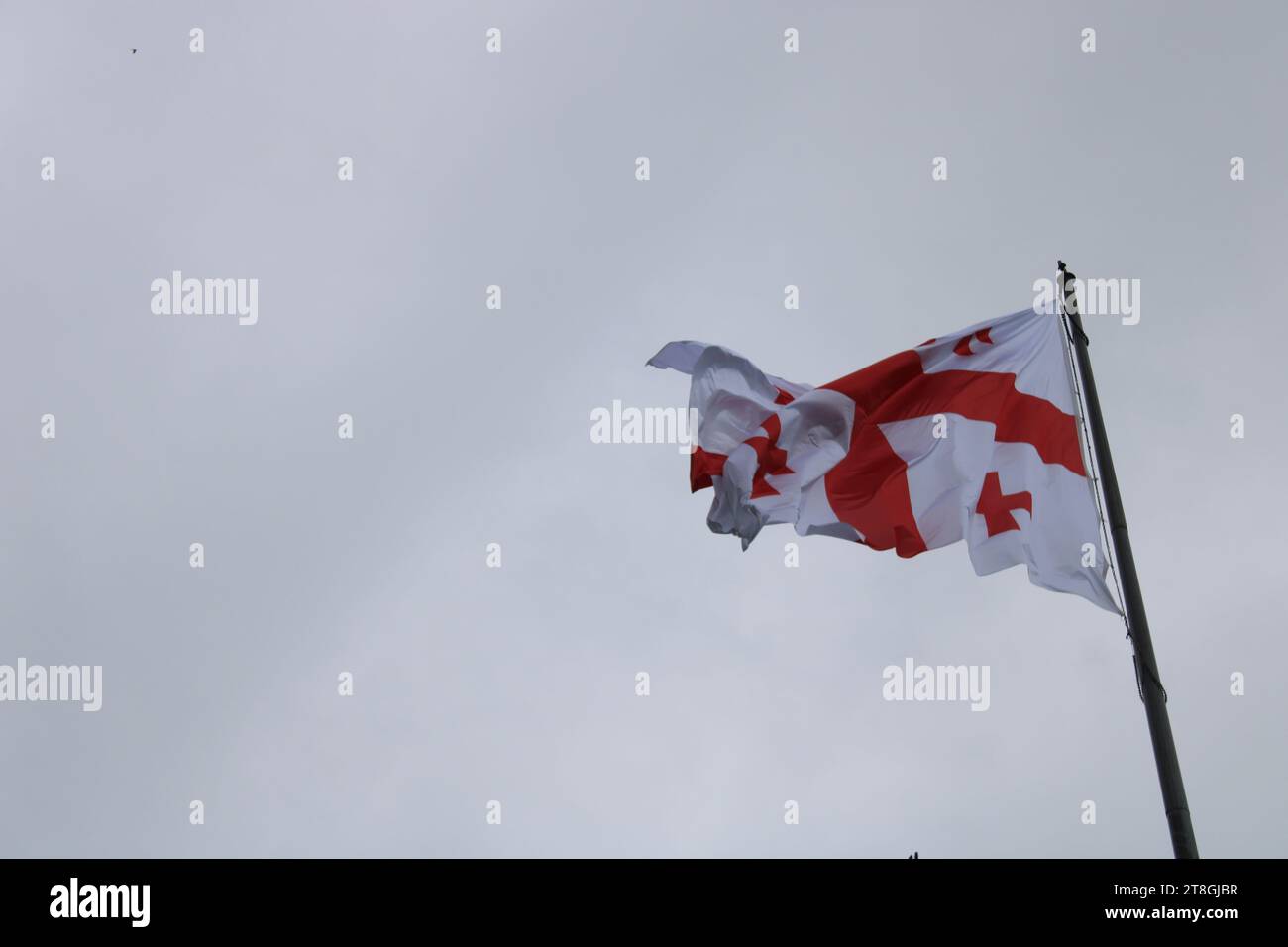 Georgian flag waving in the sky Stock Photo - Alamy