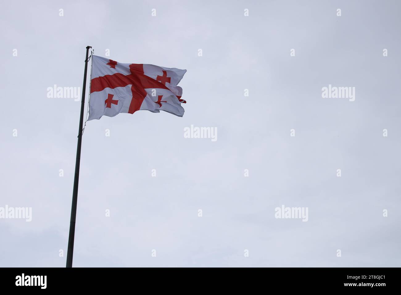 Georgian flag waving in the sky Stock Photo - Alamy