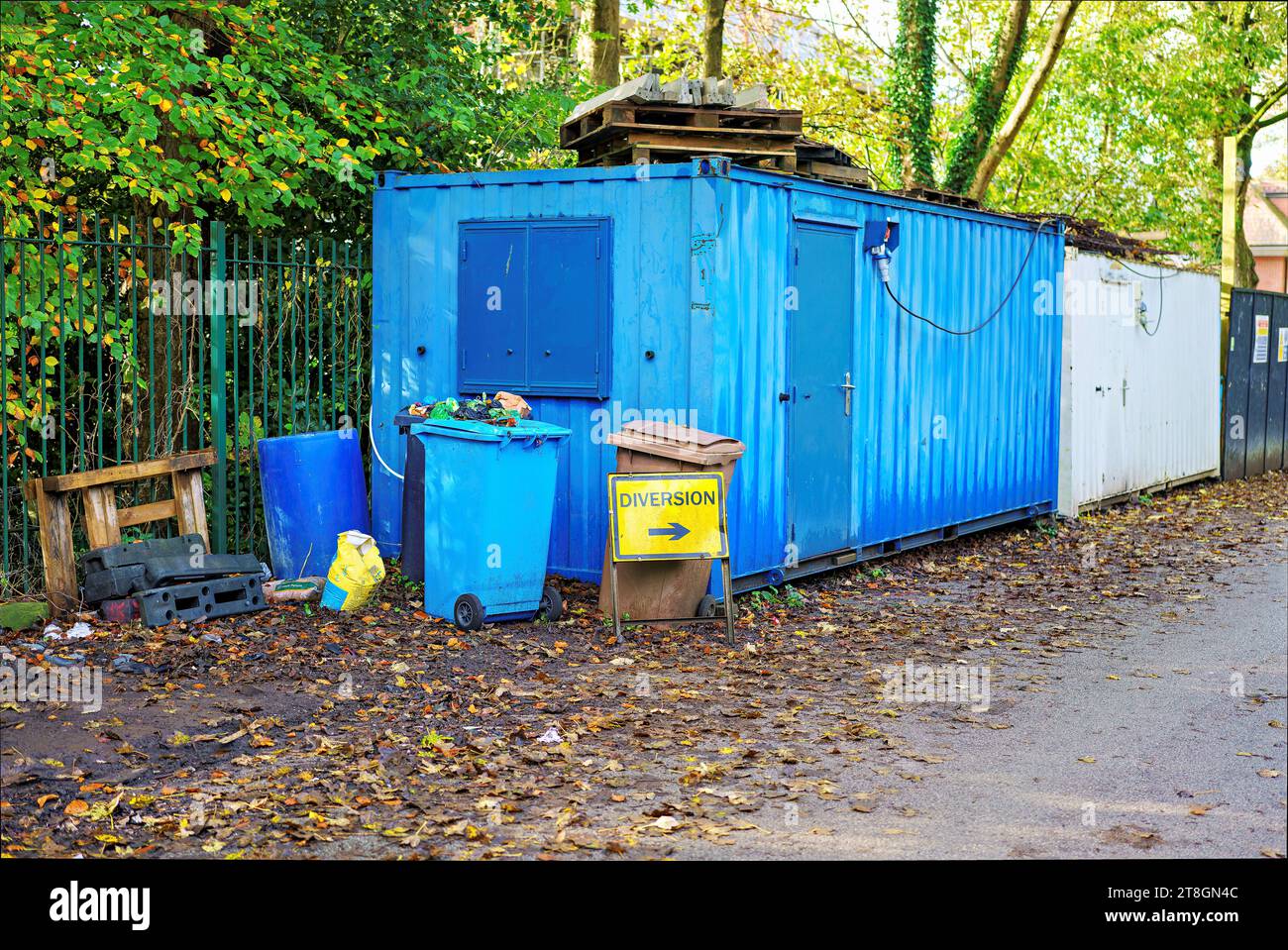 blue shipping containers used as builders storage and office space at ...