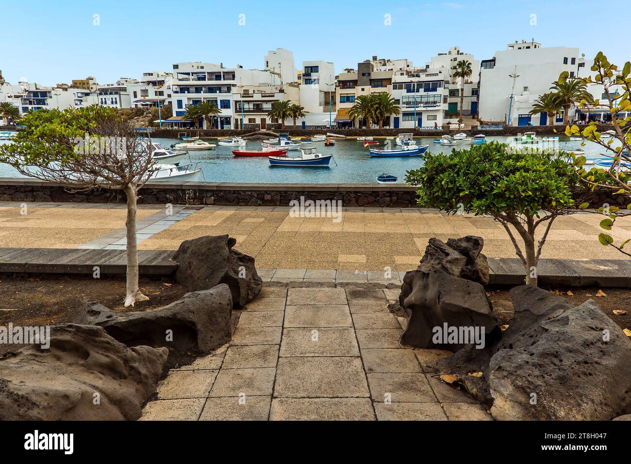 The view from a small park of boats moored in the lagoon of Charco de ...