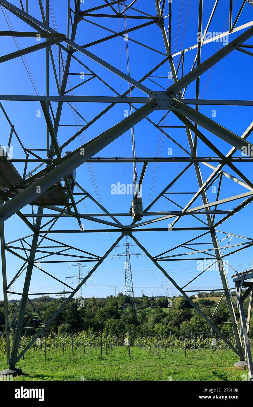 View through a power pylon to another power pylon Stock Photo - Alamy