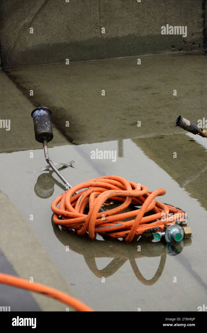 The hose and burner from a gas bottle are in the water Stock Photo - Alamy