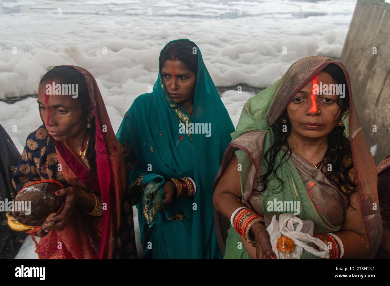 New Delhi, India. 20th Nov, 2023. Hindu devotees stand on the banks of ...