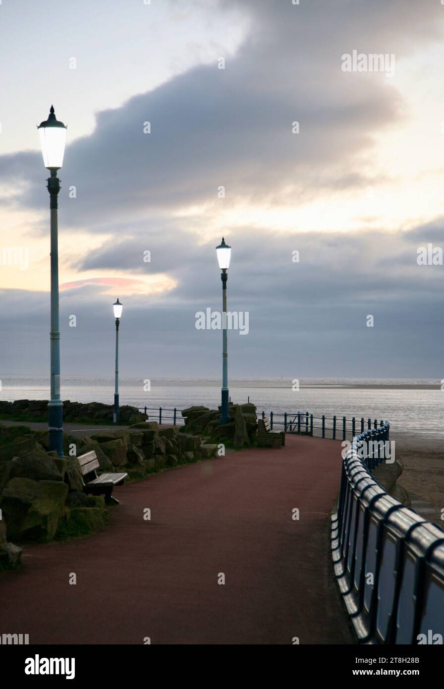 The seaside promenade at dusk Stock Photo - Alamy