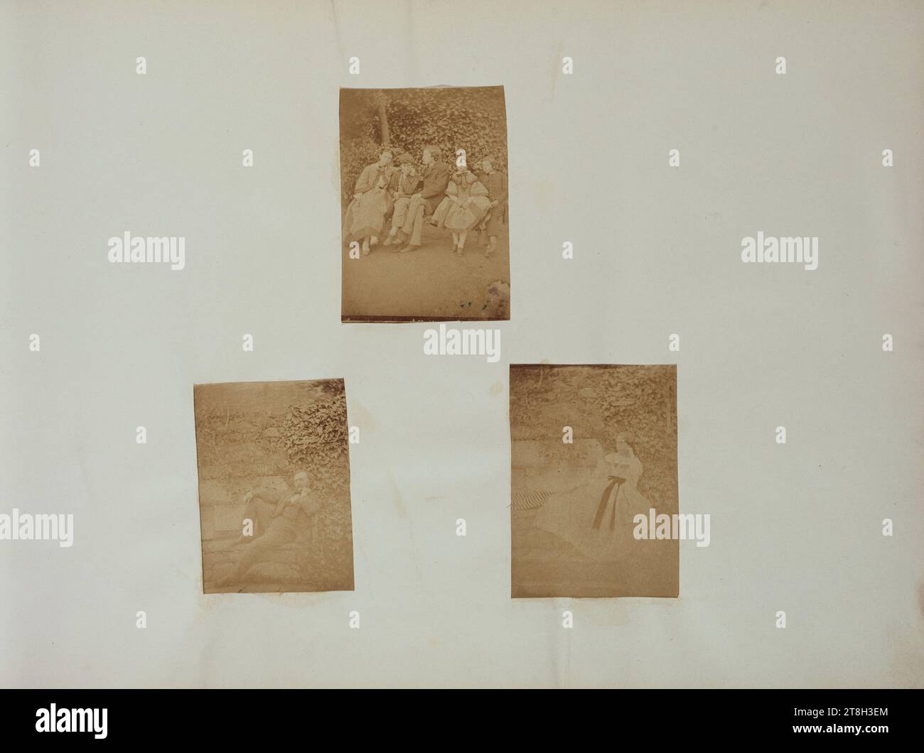 People sitting on a bench in the garden of Hauteville House ...