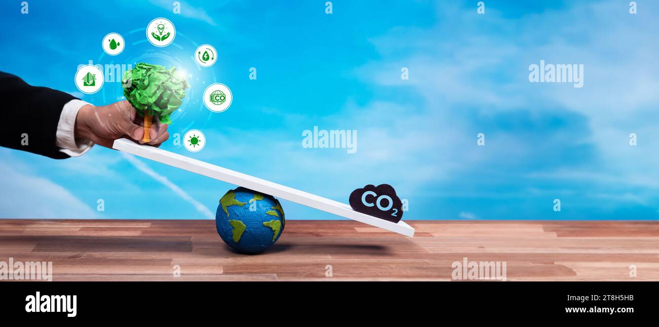 Businessman balance tree sprout on scale with CO2 emission icon ... Businessman balance tree sprout on scale with CO2 emission icon ...