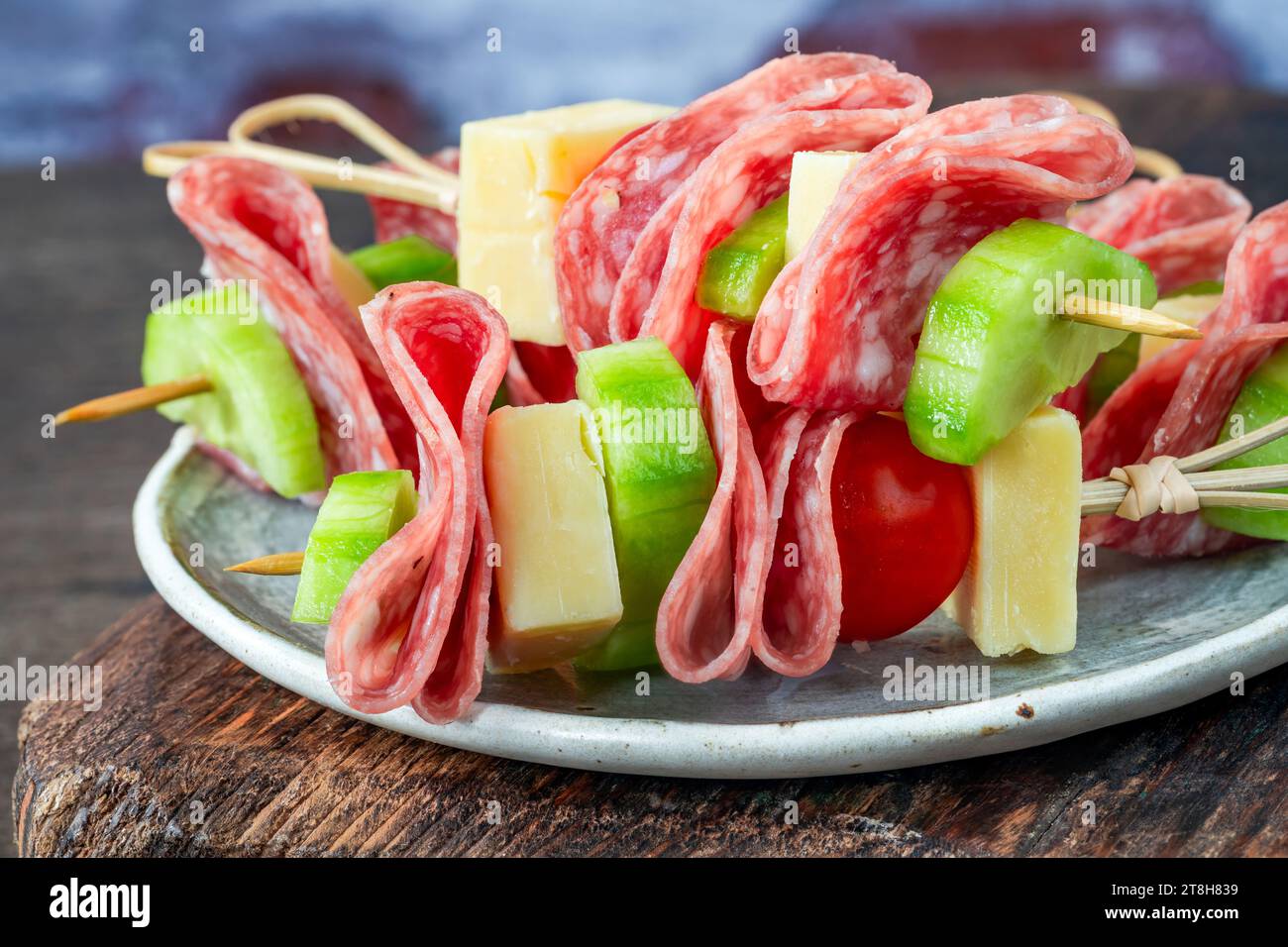 Mini Greek deli kebabs with salami, cheese, cherry tomatos and cucumber ...