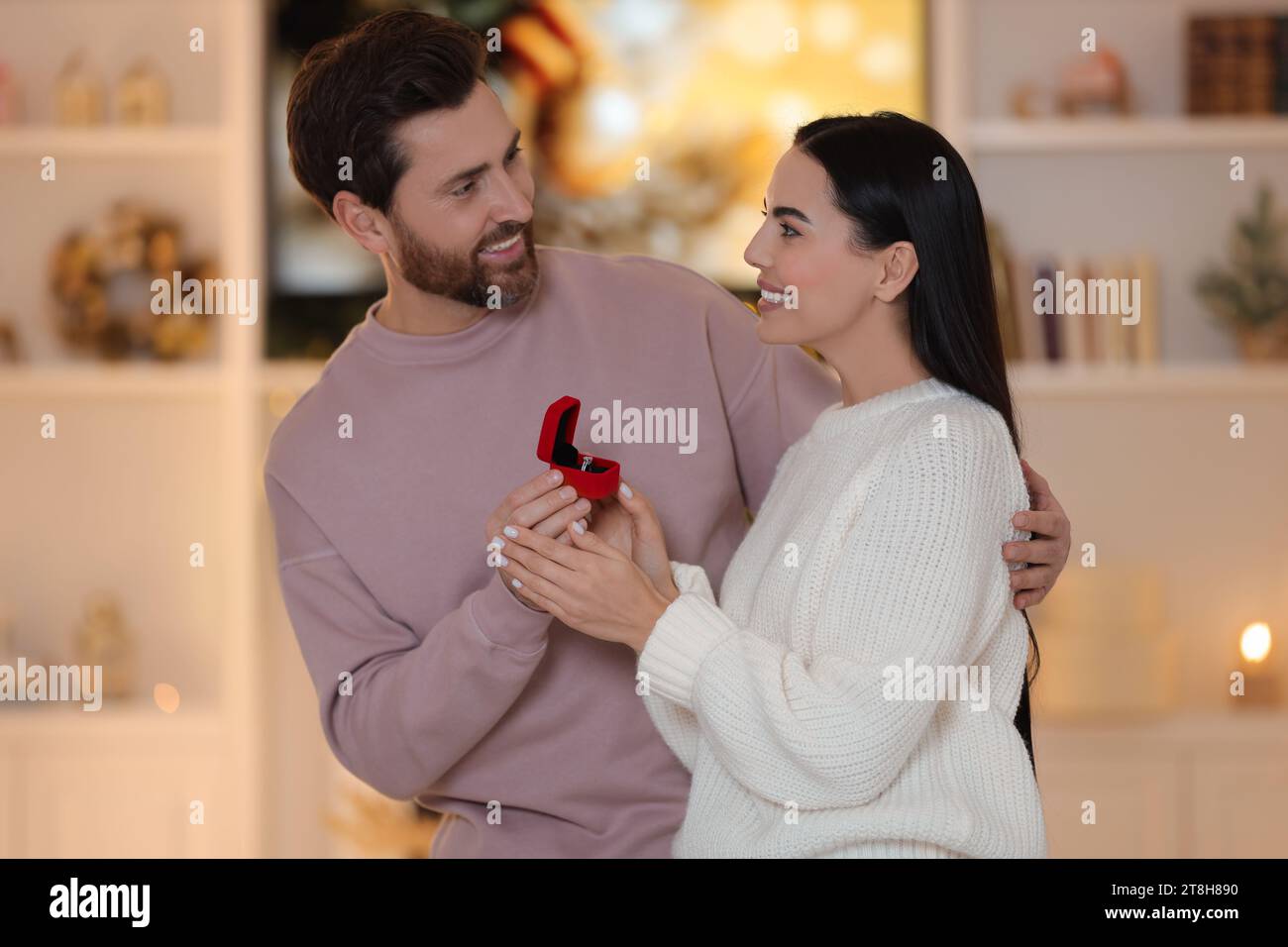 Making proposal. Man with engagement ring surprising his girlfriend at ...