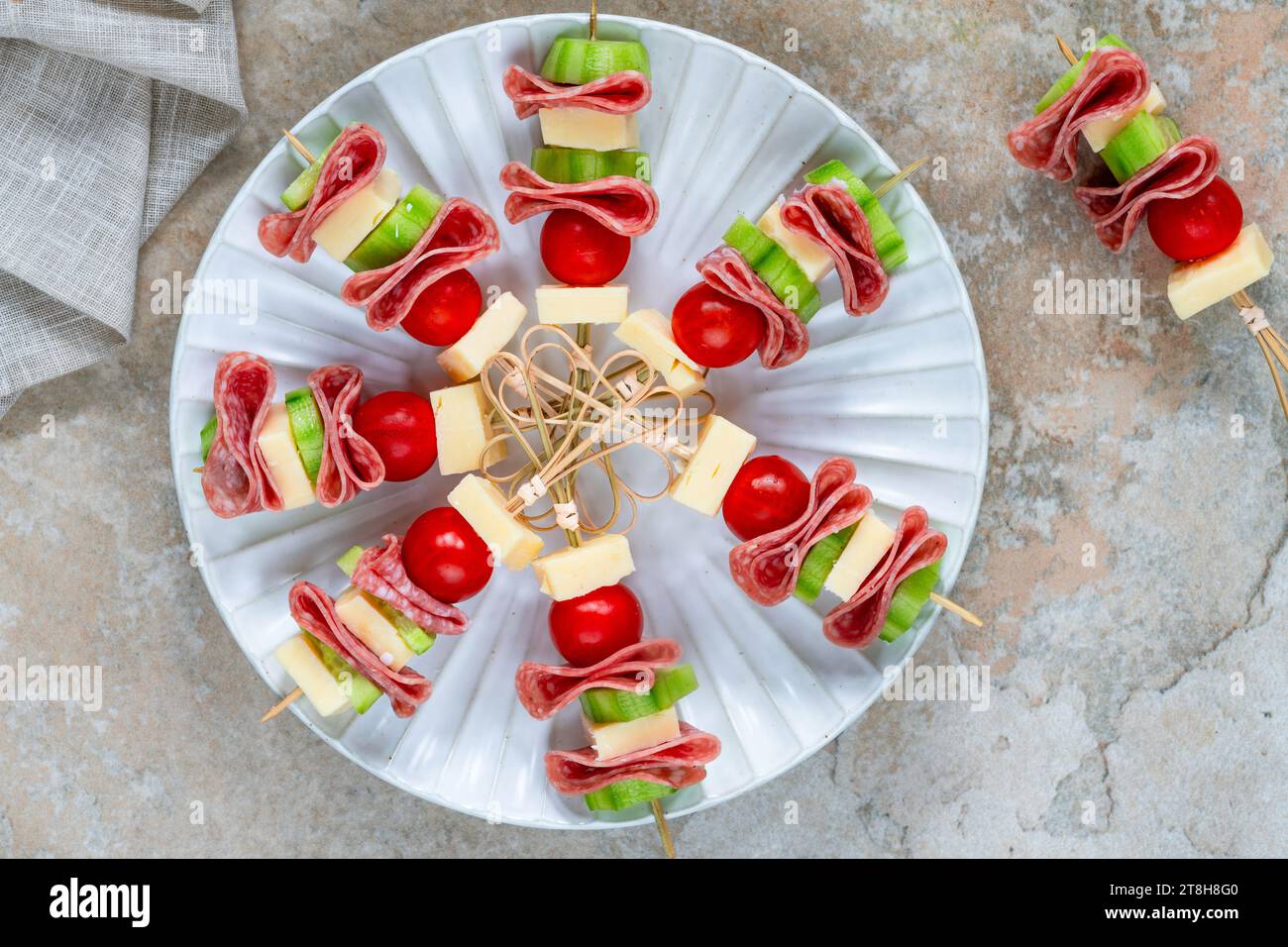 Mini Greek deli kebabs with salami, cheese, cherry tomatos and cucumber ...