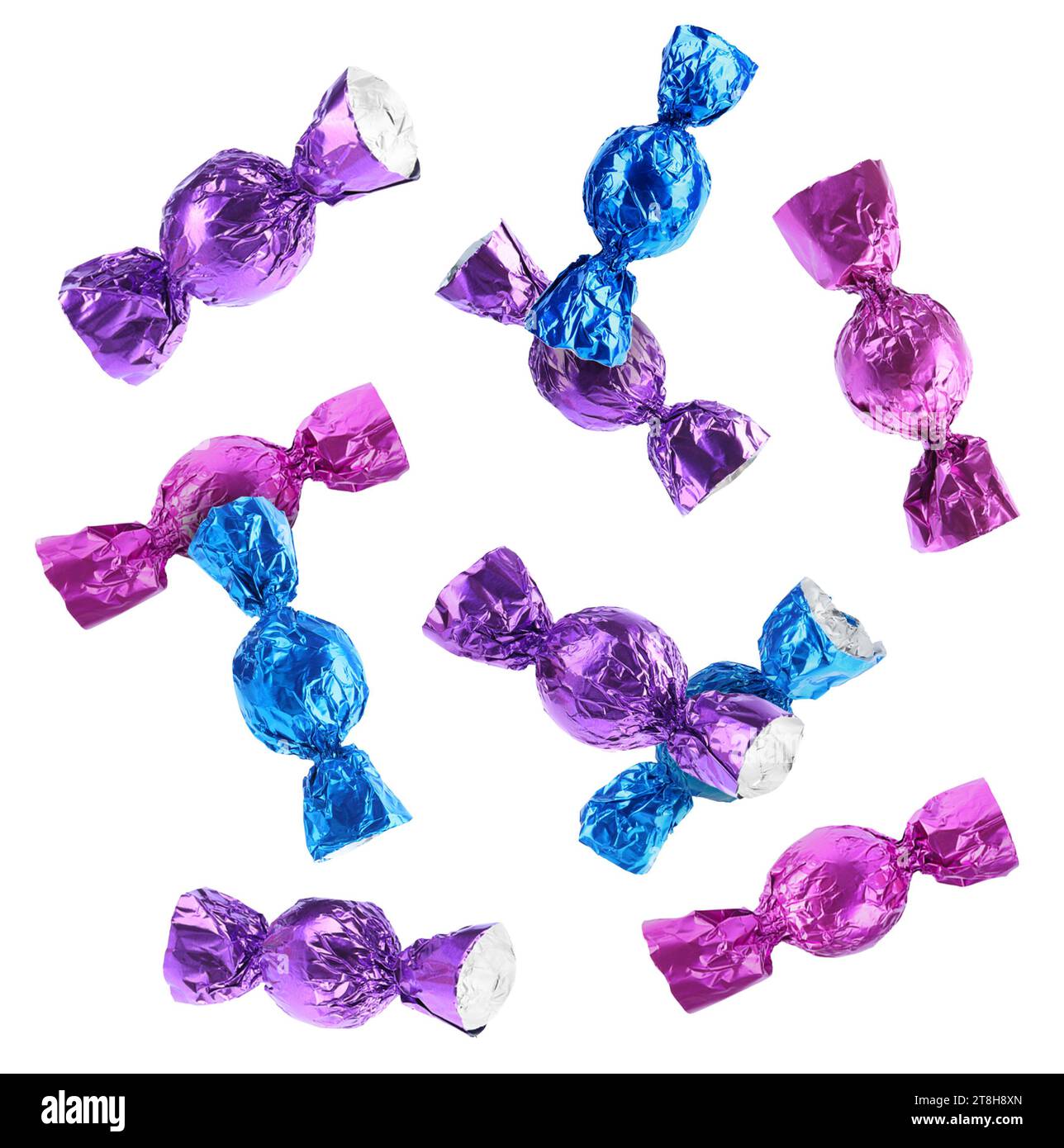 Tasty candies in bright wrappers falling on white background Stock ...