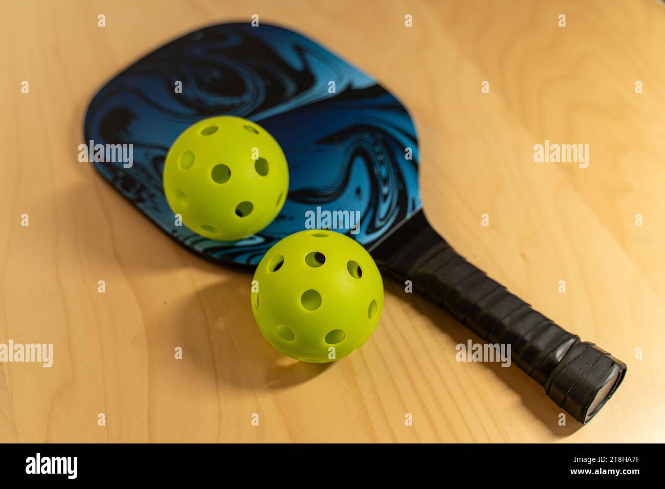 Pickleball equipment. Pickleball paddle and balls Stock Photo - Alamy