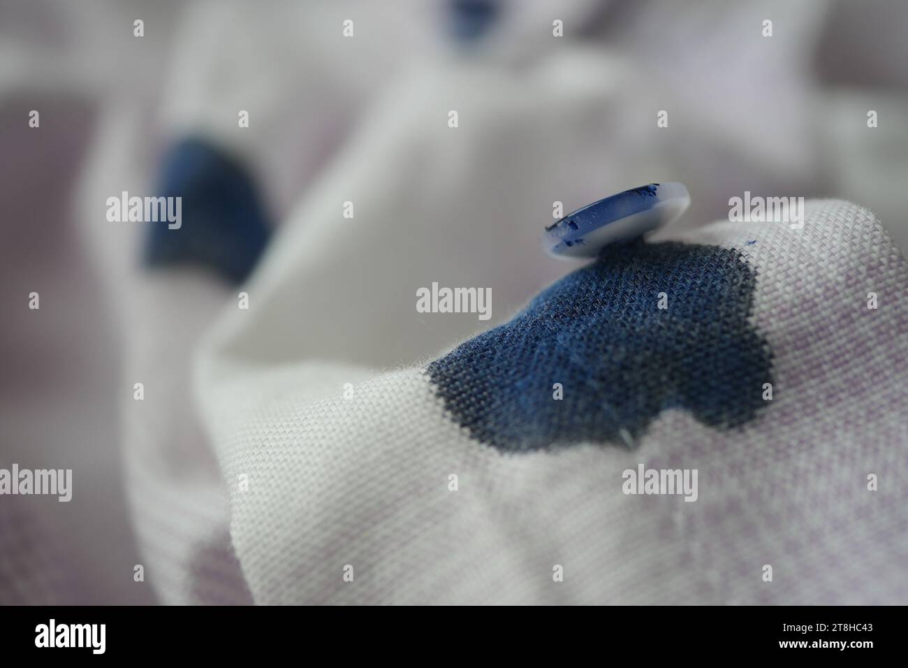 white shirt with blue ink stain Stock Photo - Alamy