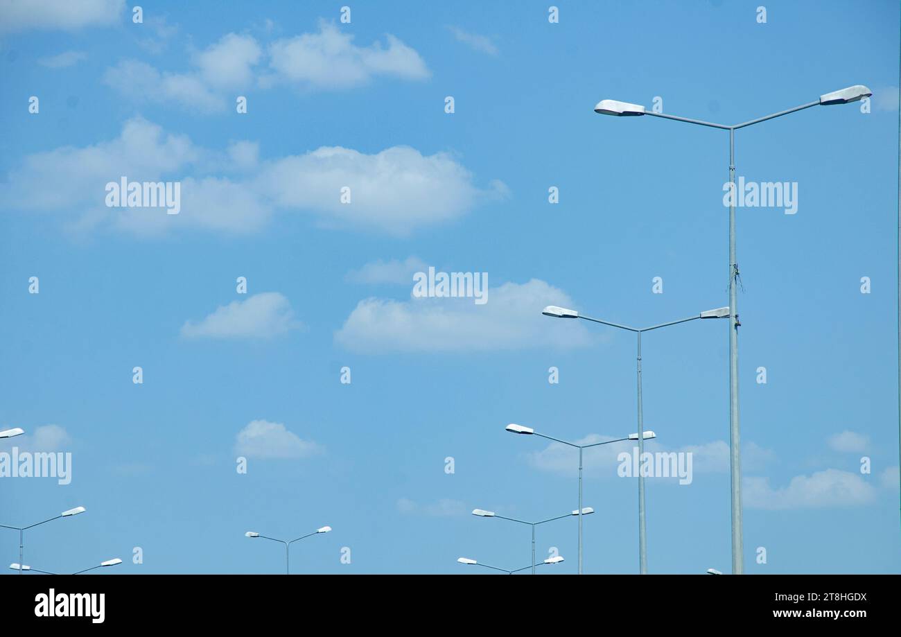 Lighting poles on the sky background Stock Photo - Alamy
