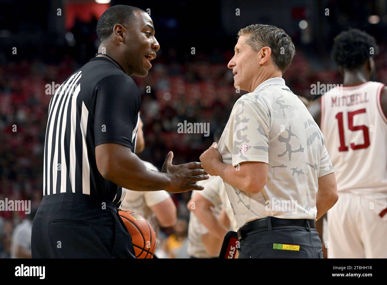 Arkansas coach Eric Musselman talks with an official on the sidelines ...