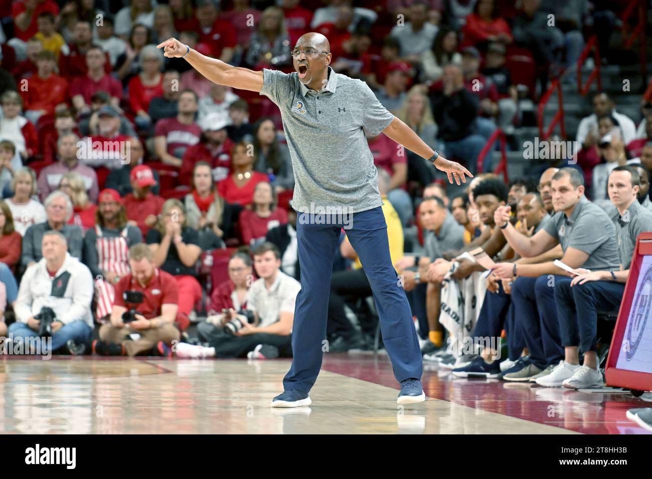 UNC Greensboro coach Mike Jones on the sidelines against Arkansas ...