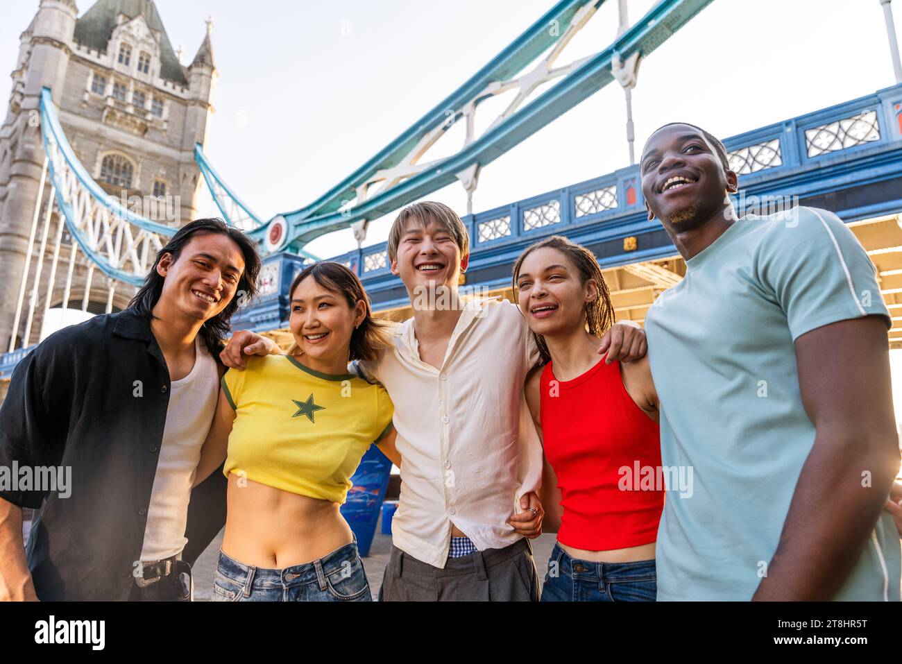 Multiracial group of happy young friends bonding in London city - Multiethnic teens students ...