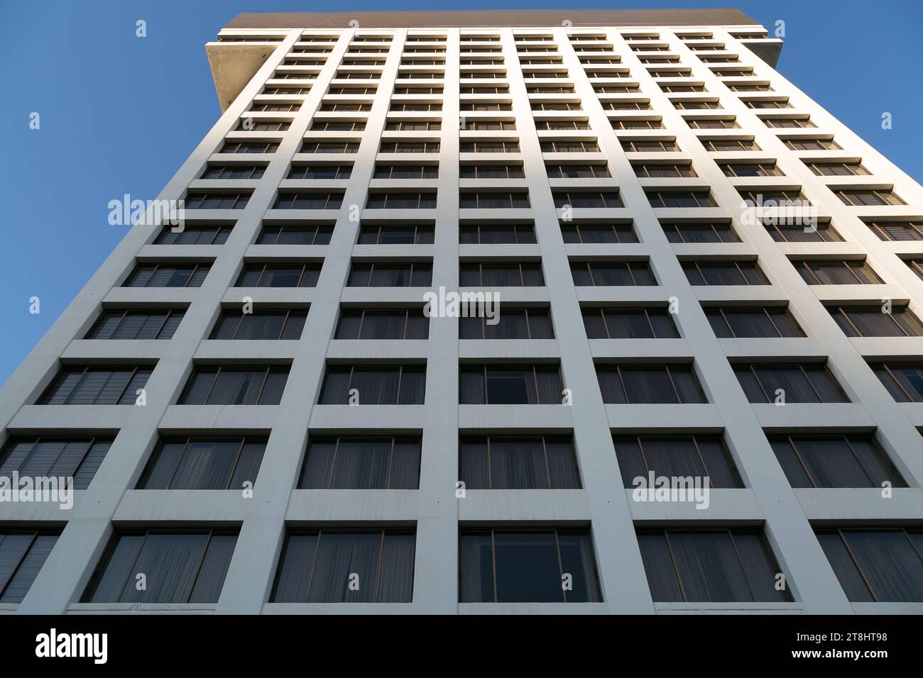 An iconic high-rise building with a glossy exterior, standing tall ...