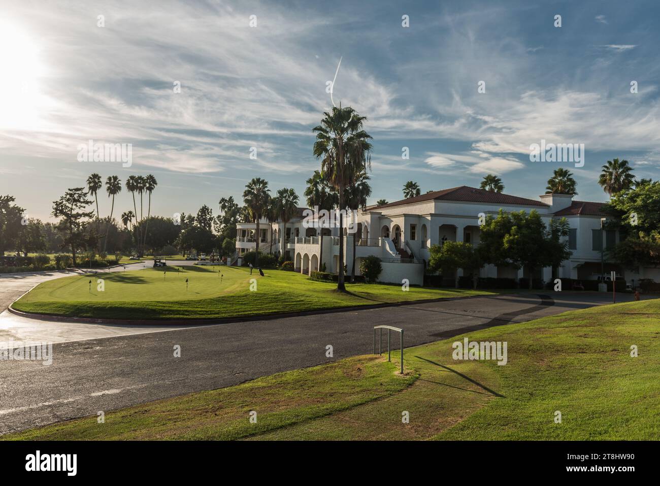 This image depicts a luxurious two-story residence situated on a ...