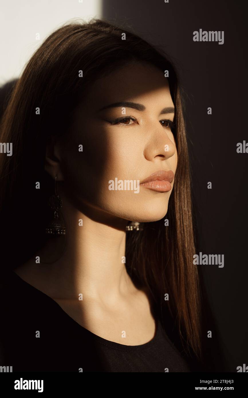 Woman Basking in Golden Hour Light Stock Photo - Alamy