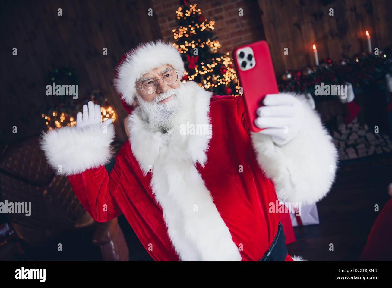 Photo of good mood friendly santa claus wear red costume waving arm hi ...