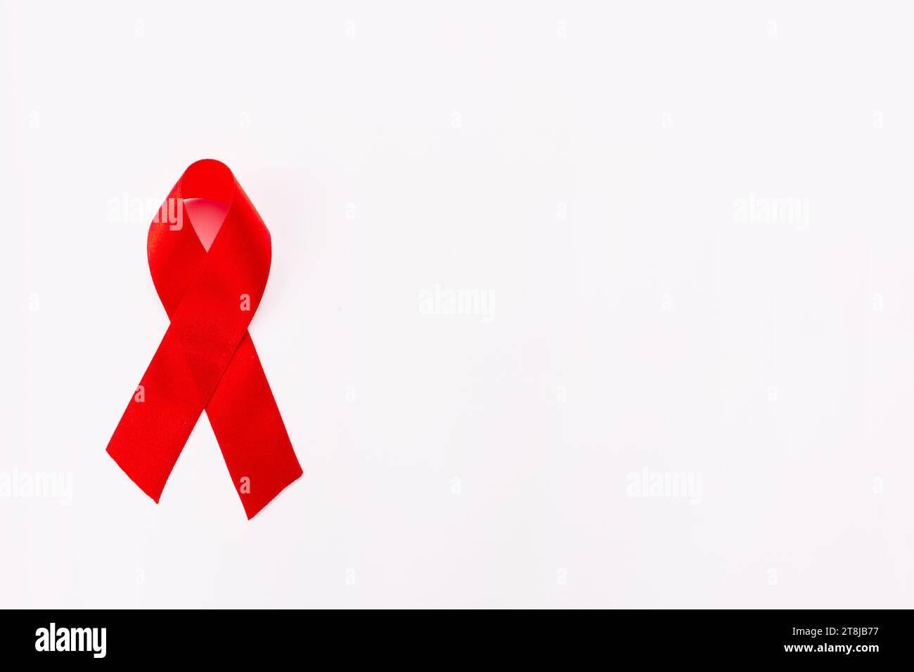 Red ribbon HIV, AIDS on white background, Awareness,Top view Stock Photo - Alamy
