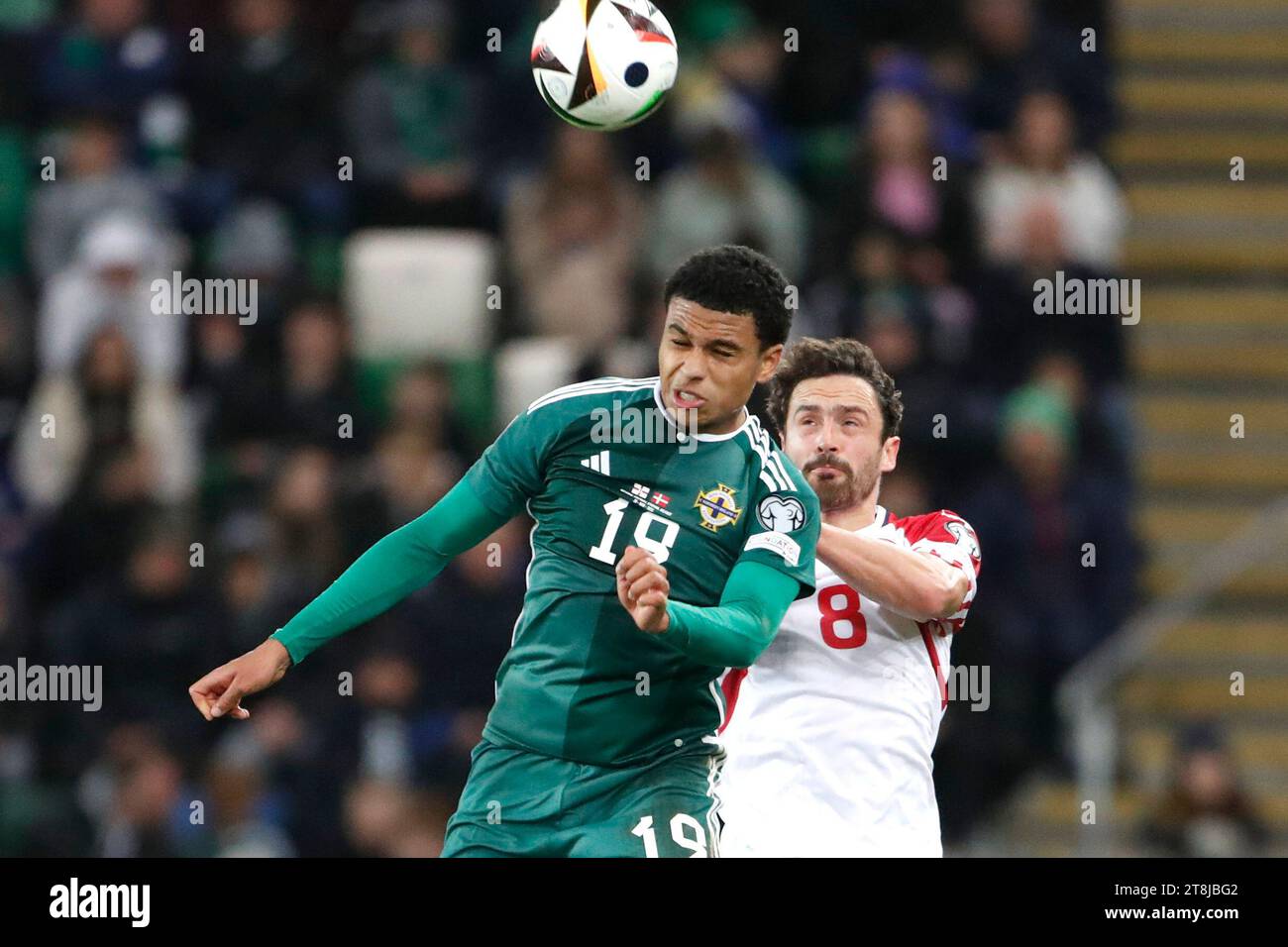 Northern Ireland's Shea Charles challenges for the ball with Denmark's ...