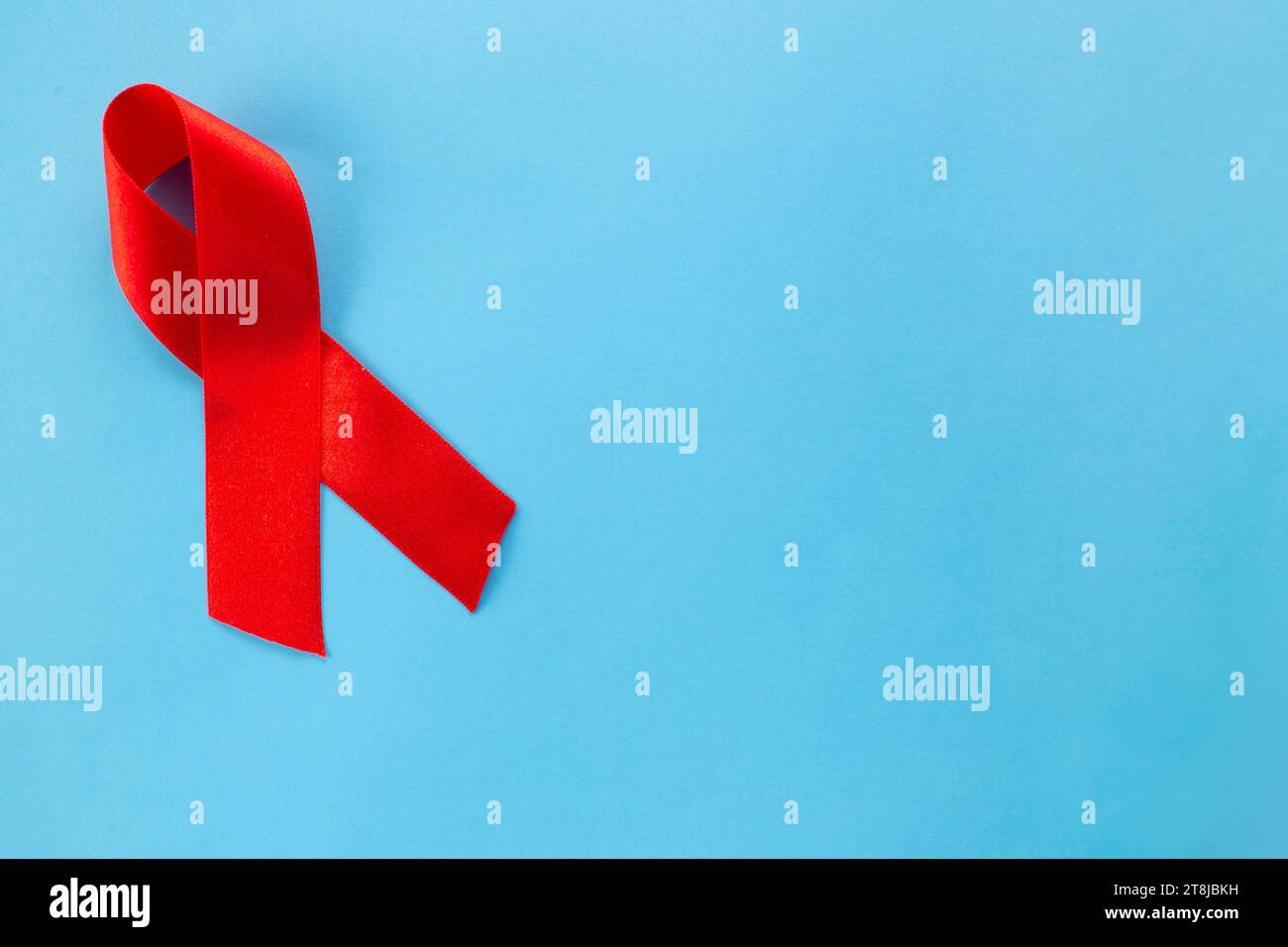 Red ribbon HIV, AIDS on blue background, Awareness,Top view Stock Photo ...