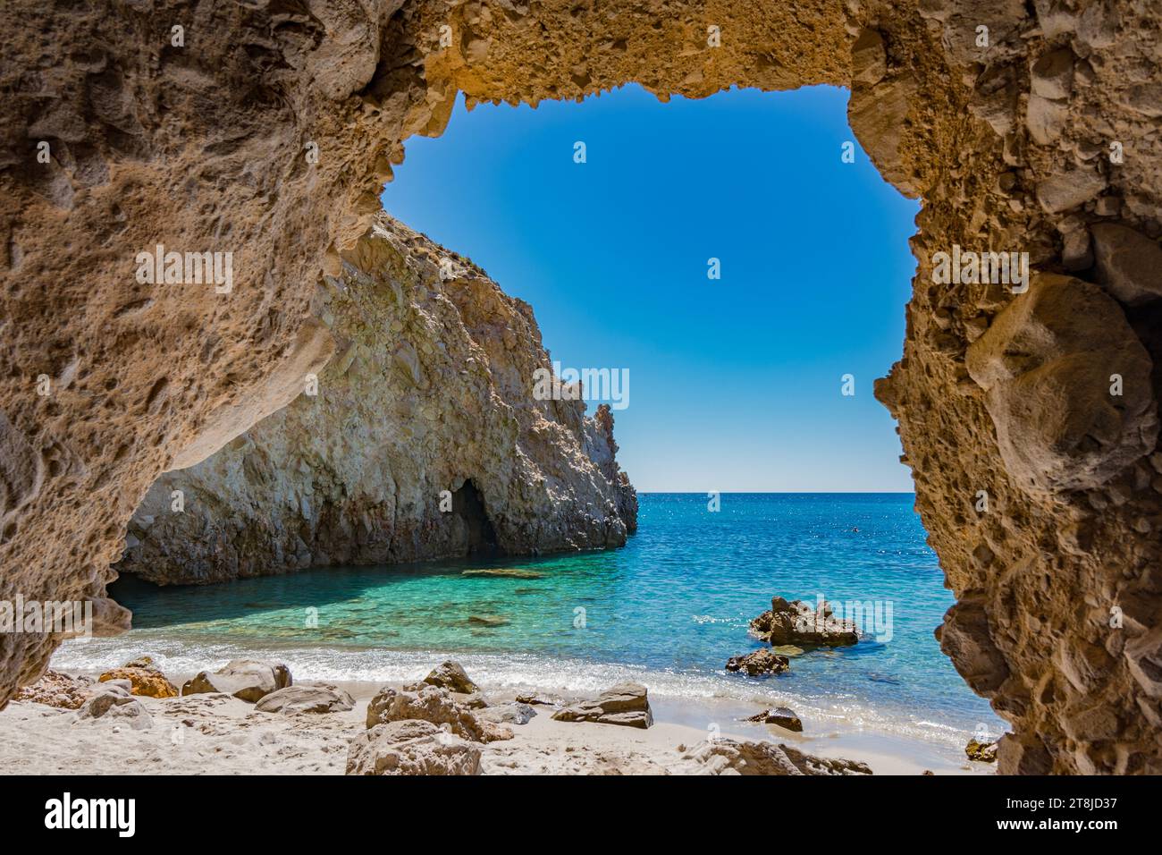 Tsigrado beach seen from inside a cave, Milos Stock Photo - Alamy