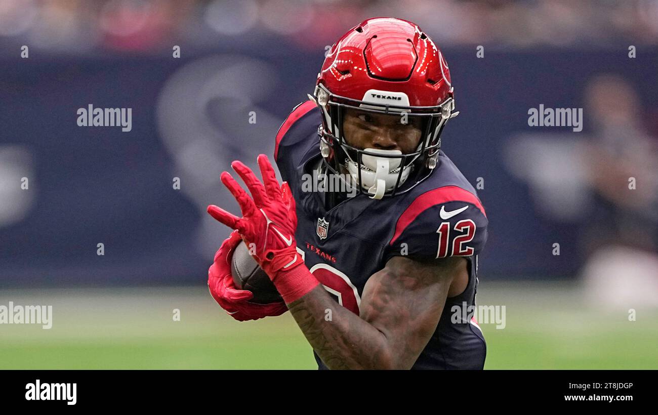 Houston Texans' Nico Collins (12) runs after catching a pass against ...