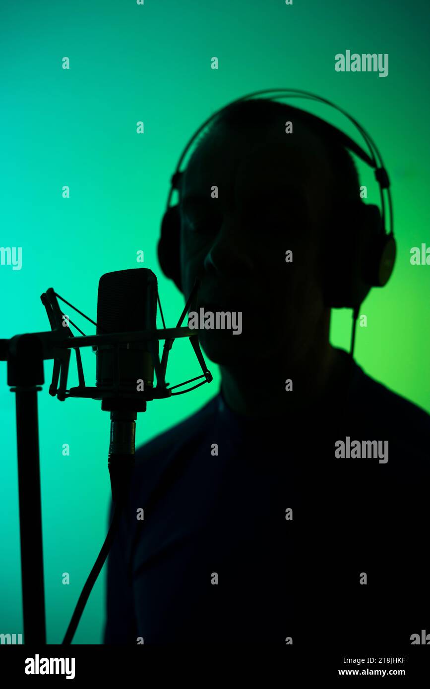 Voiceover artist voice actor in vocal recording studio with larg ...