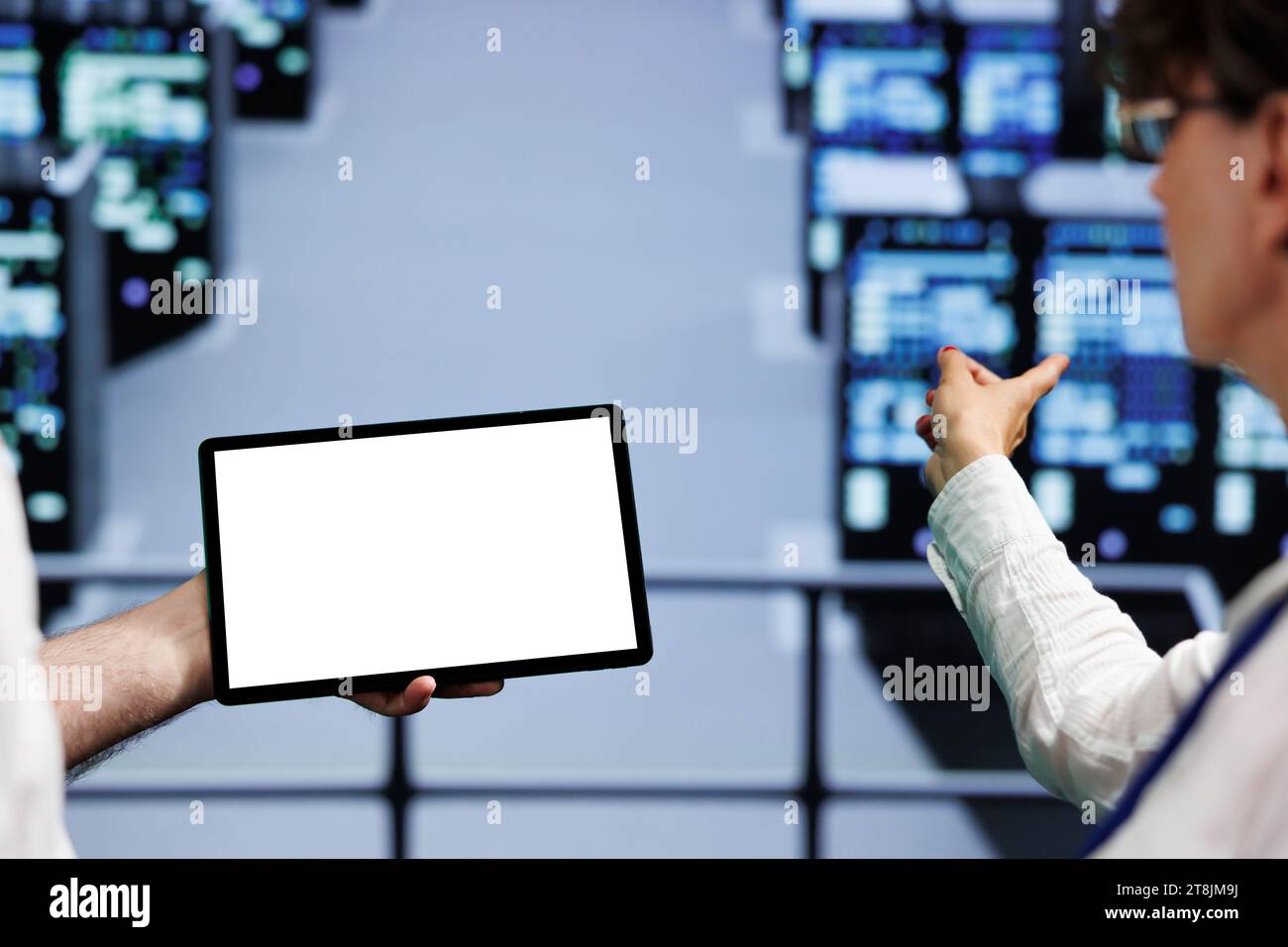 Skillful System Administrators Using Mock Up Tablet To Check Supercomputers Close Up Devices