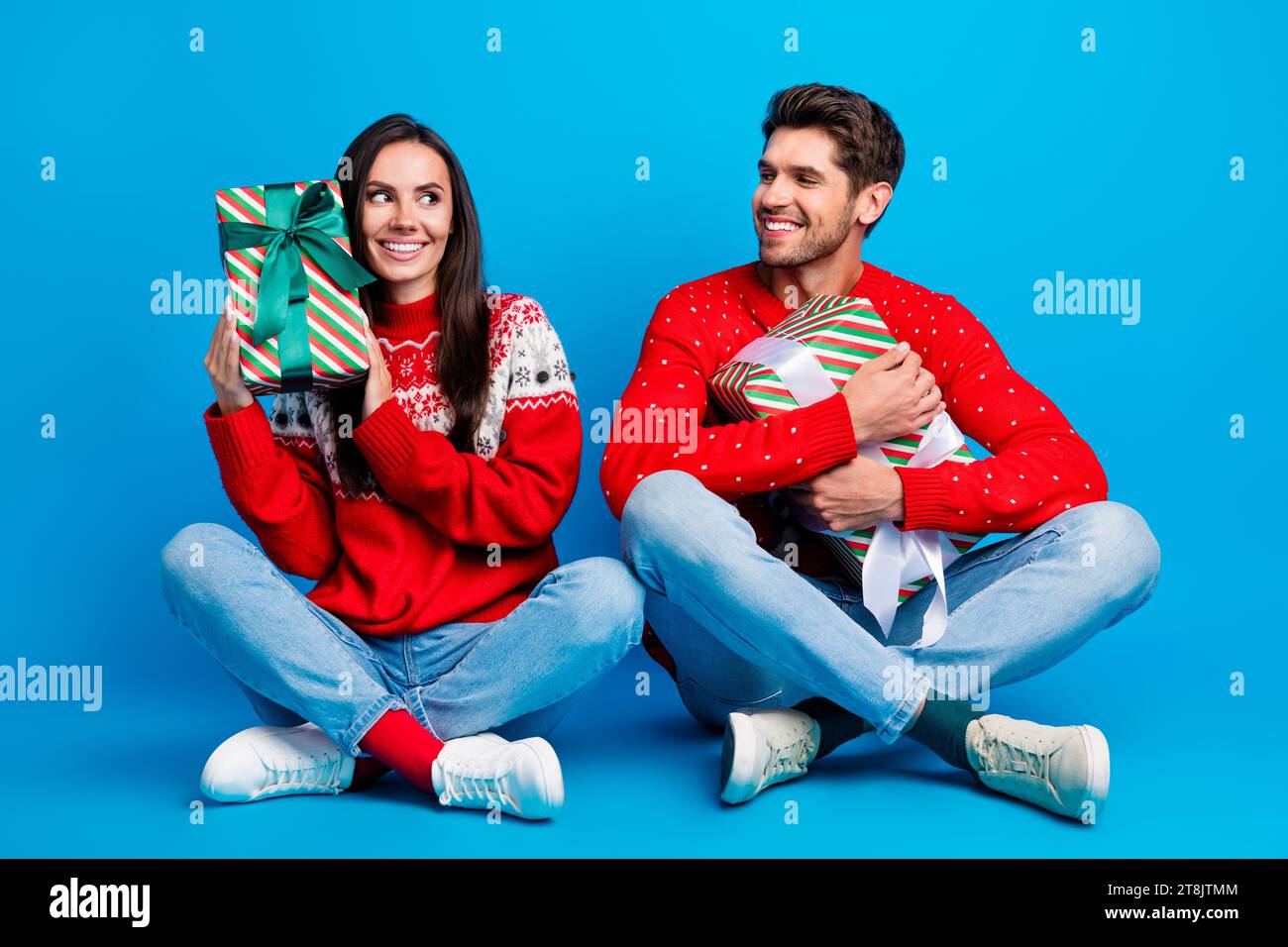 Full length photo of two attractive funny friendly people sitting give ...