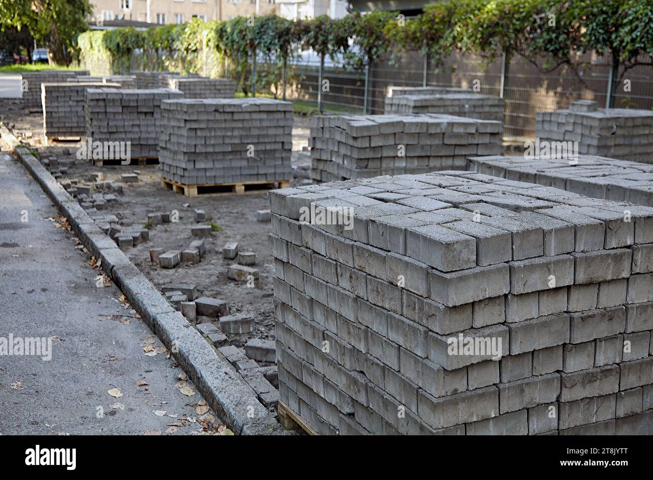 Pallets with paving slabs on a street being repaired Stock Photo - Alamy