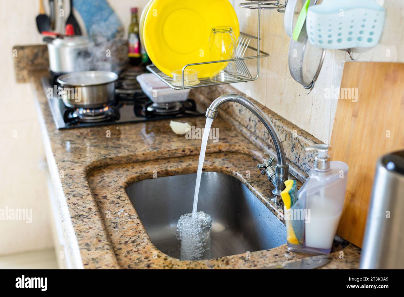 Open sink tap dripping water. take care of the environment. Waste of ...
