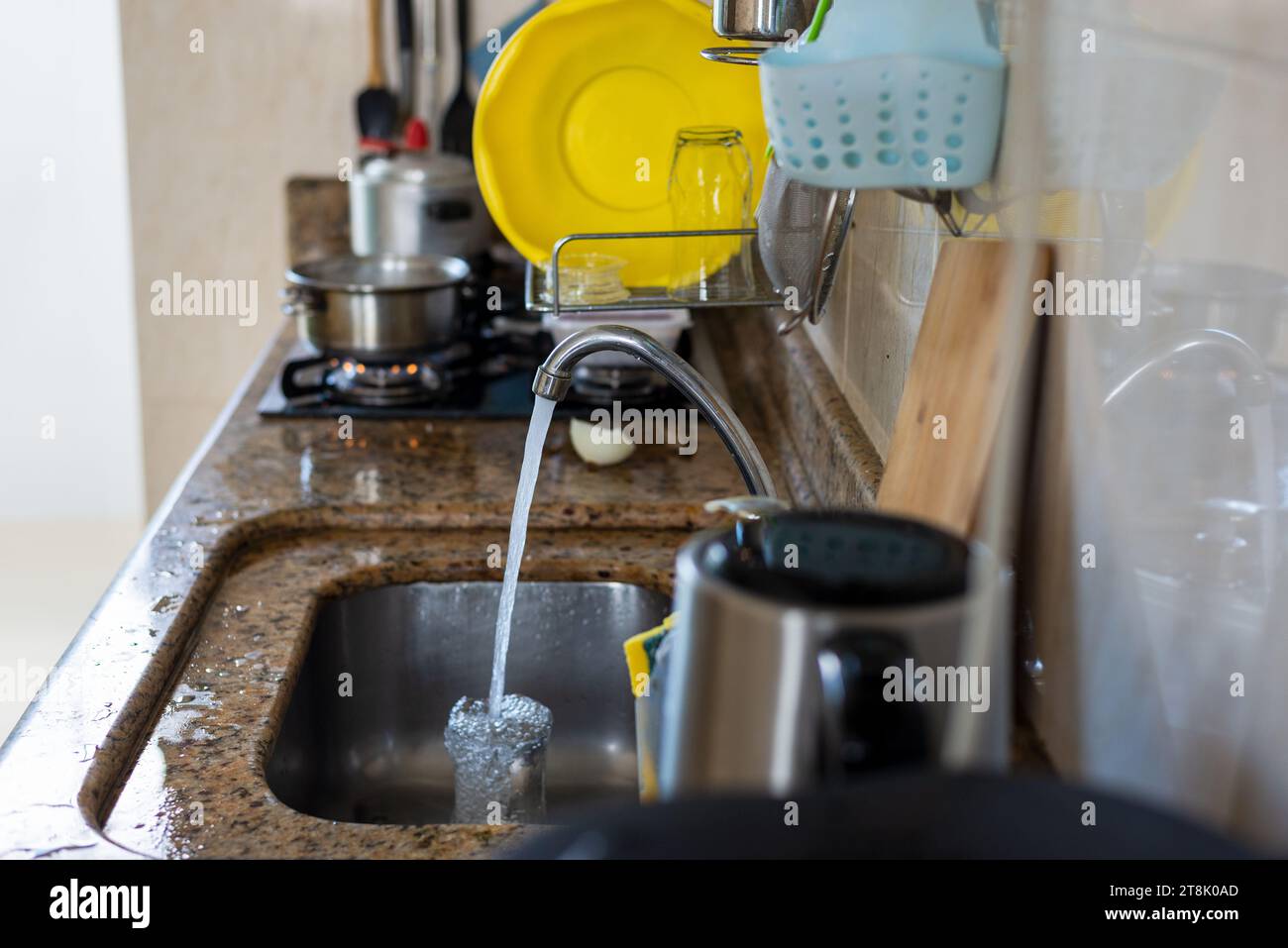Open sink tap dripping water. take care of the environment. Waste of ...
