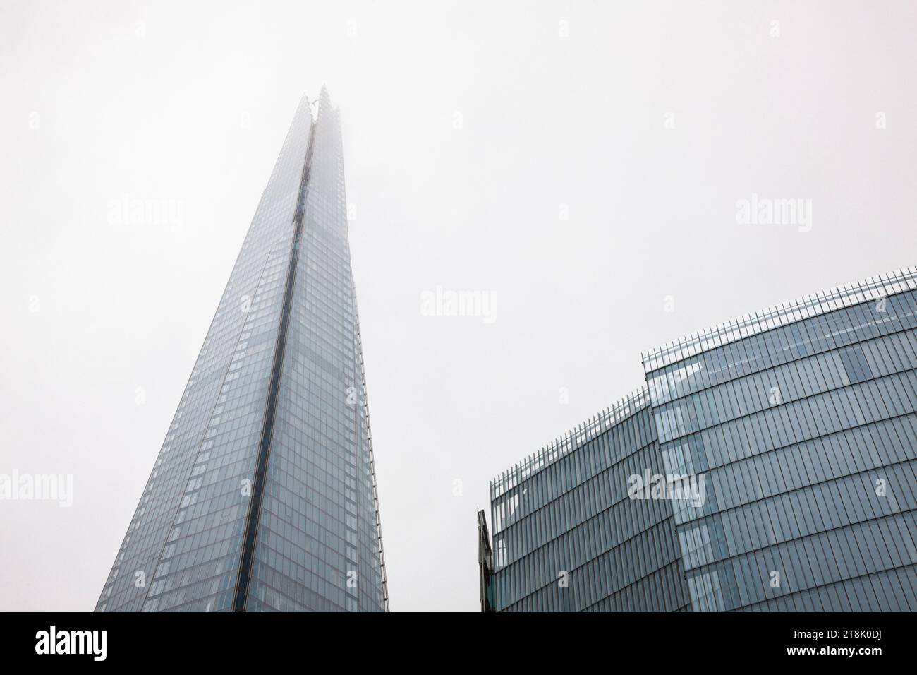Low angle view of The Shard office building on grey day, London ...