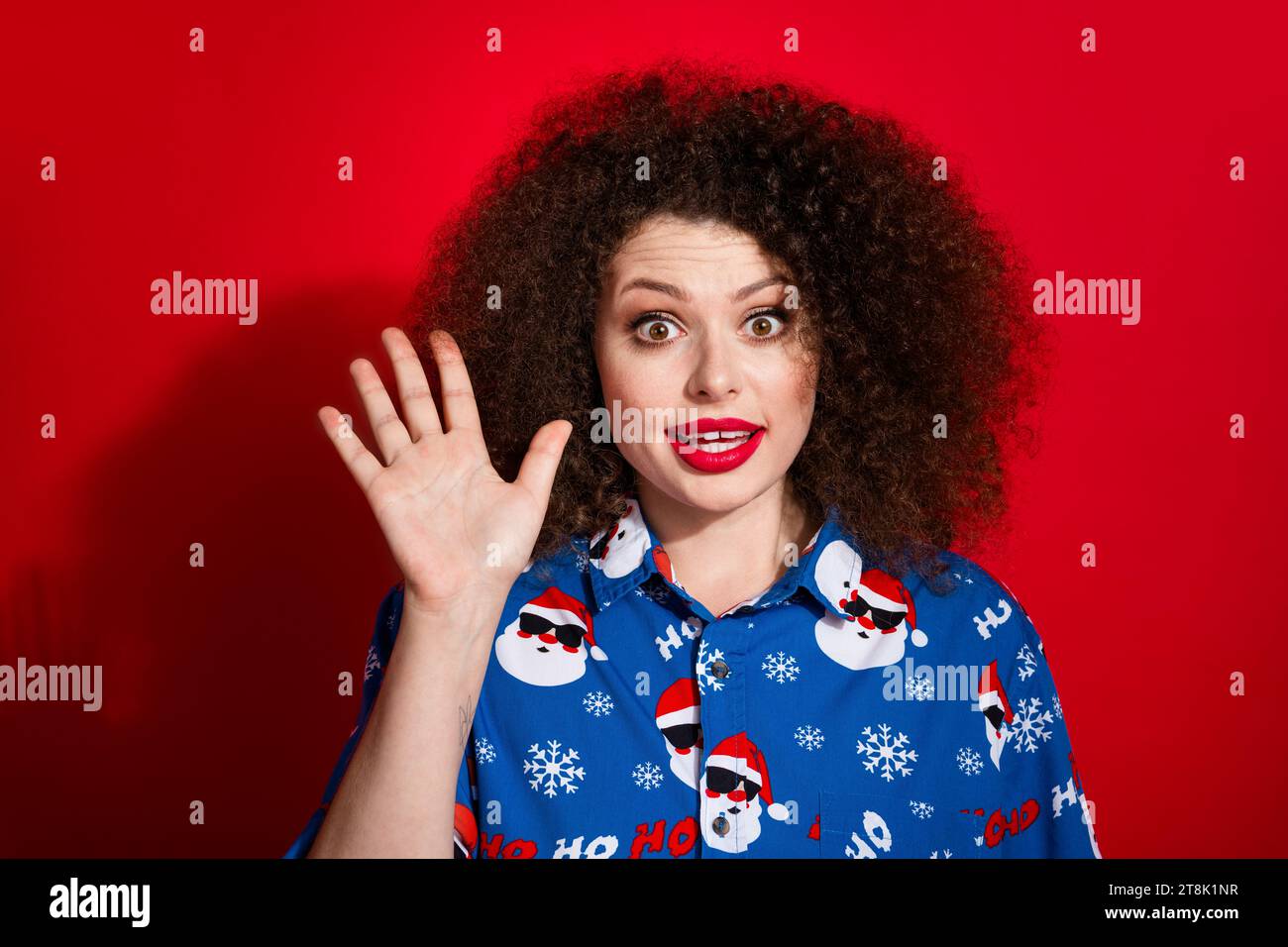 Photo portrait of pretty young girl waving hand excited hello dressed stylish blue x-mas print ...