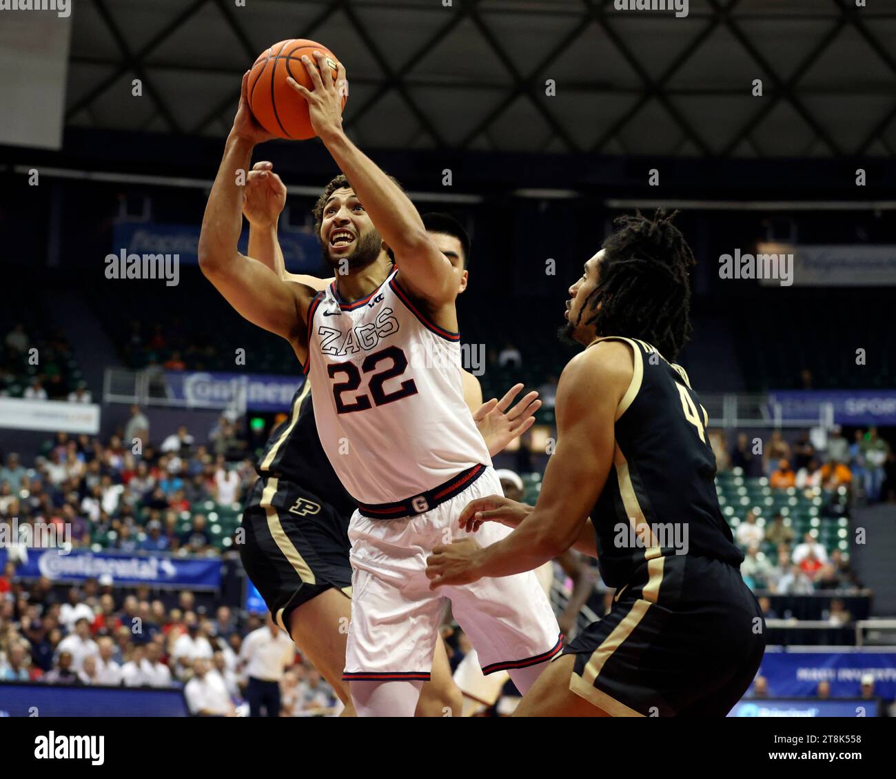 Gonzaga forward Anton Watson (22) goes for the net between Purdue ...