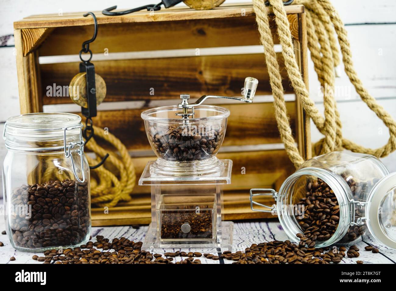 coffee mill, glass, rack and roasted coffee beans Stock Photo - Alamy
