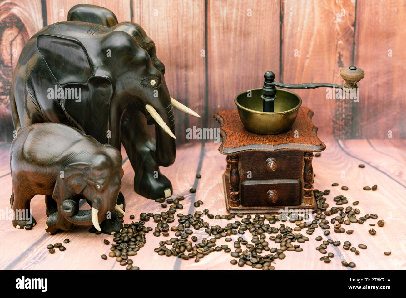 coffee mill with coffee beans and elephants Stock Photo - Alamy