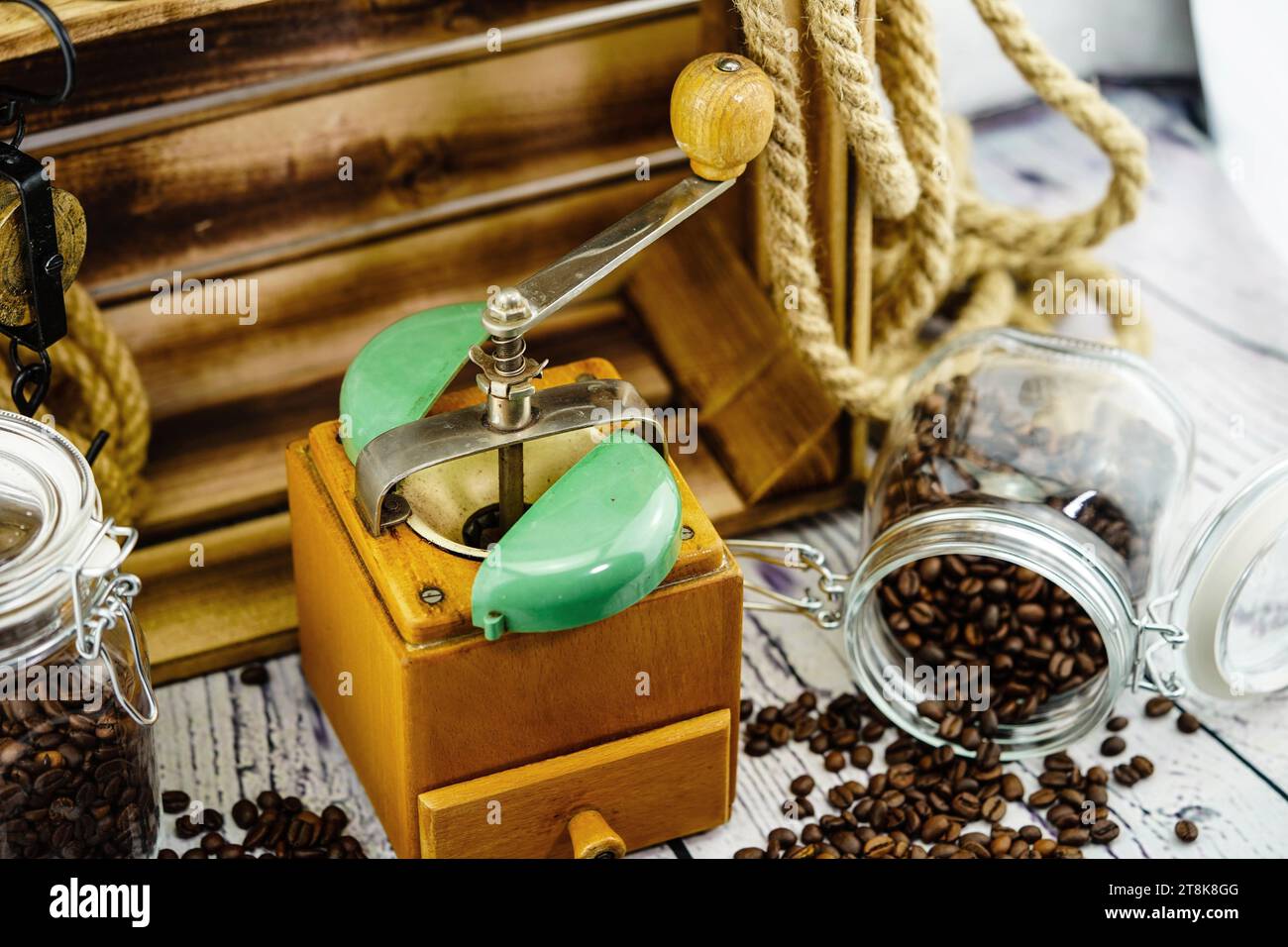 coffee mill, glass, rack and roasted coffee beans Stock Photo - Alamy