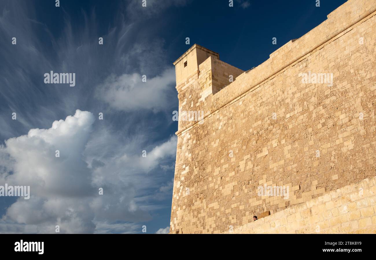 Close-up of the high wall of the historic citadel on Gozo in Malta. The ...