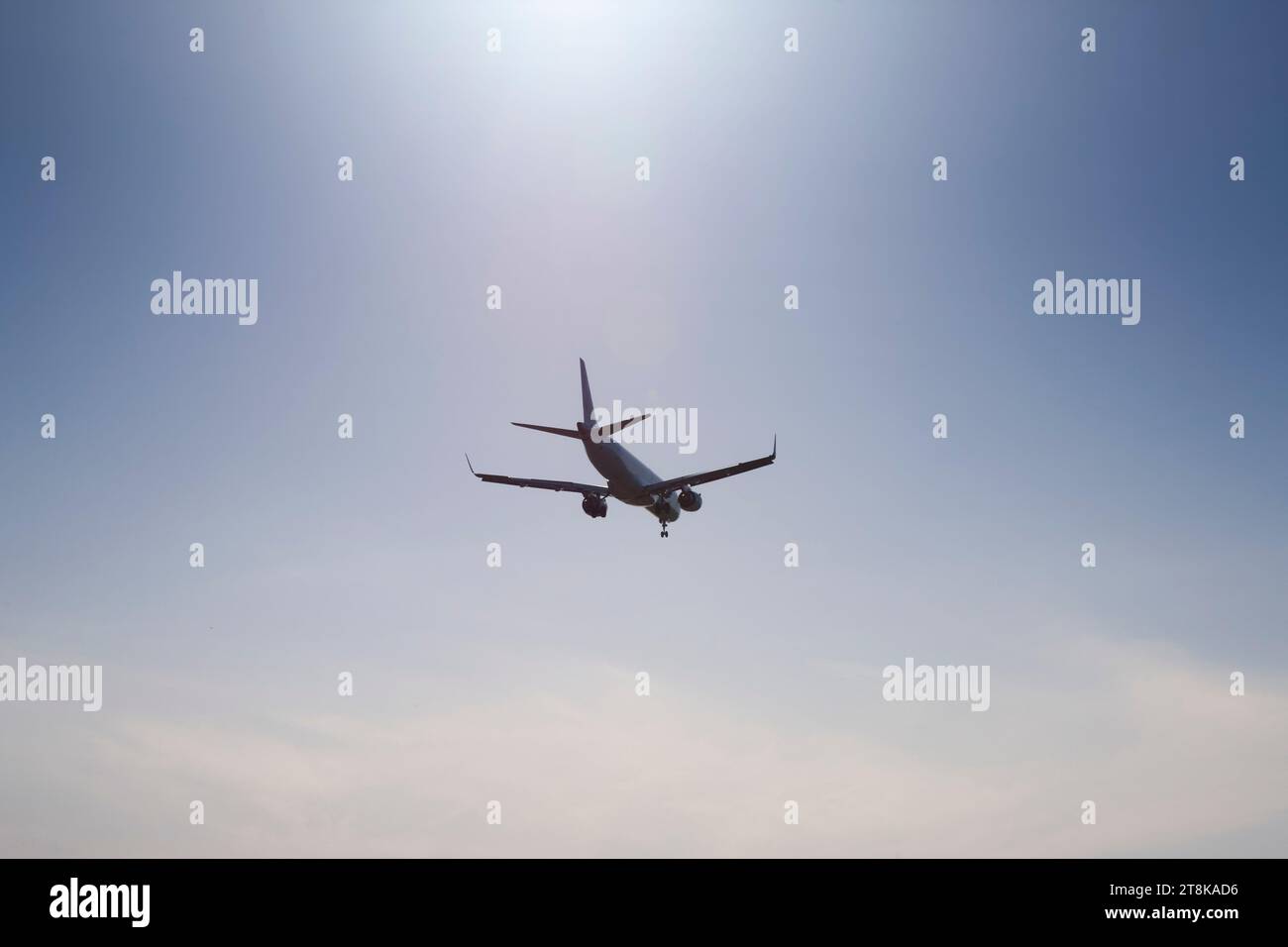 Rear view of Commercial Airplane with sun glare Stock Photo - Alamy