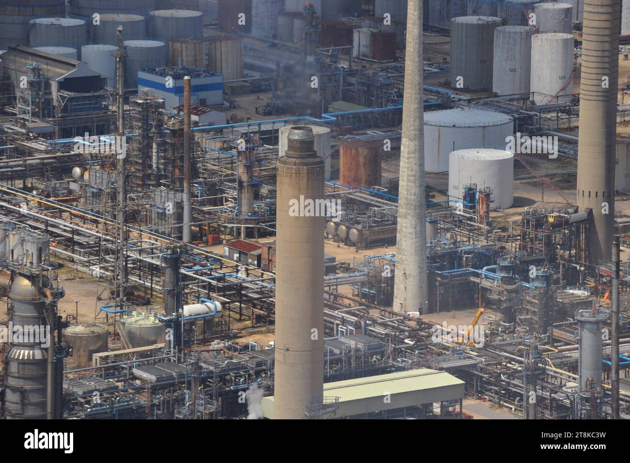 Aerial photograph of the flare stacks of Fawley refinery on the edge of ...